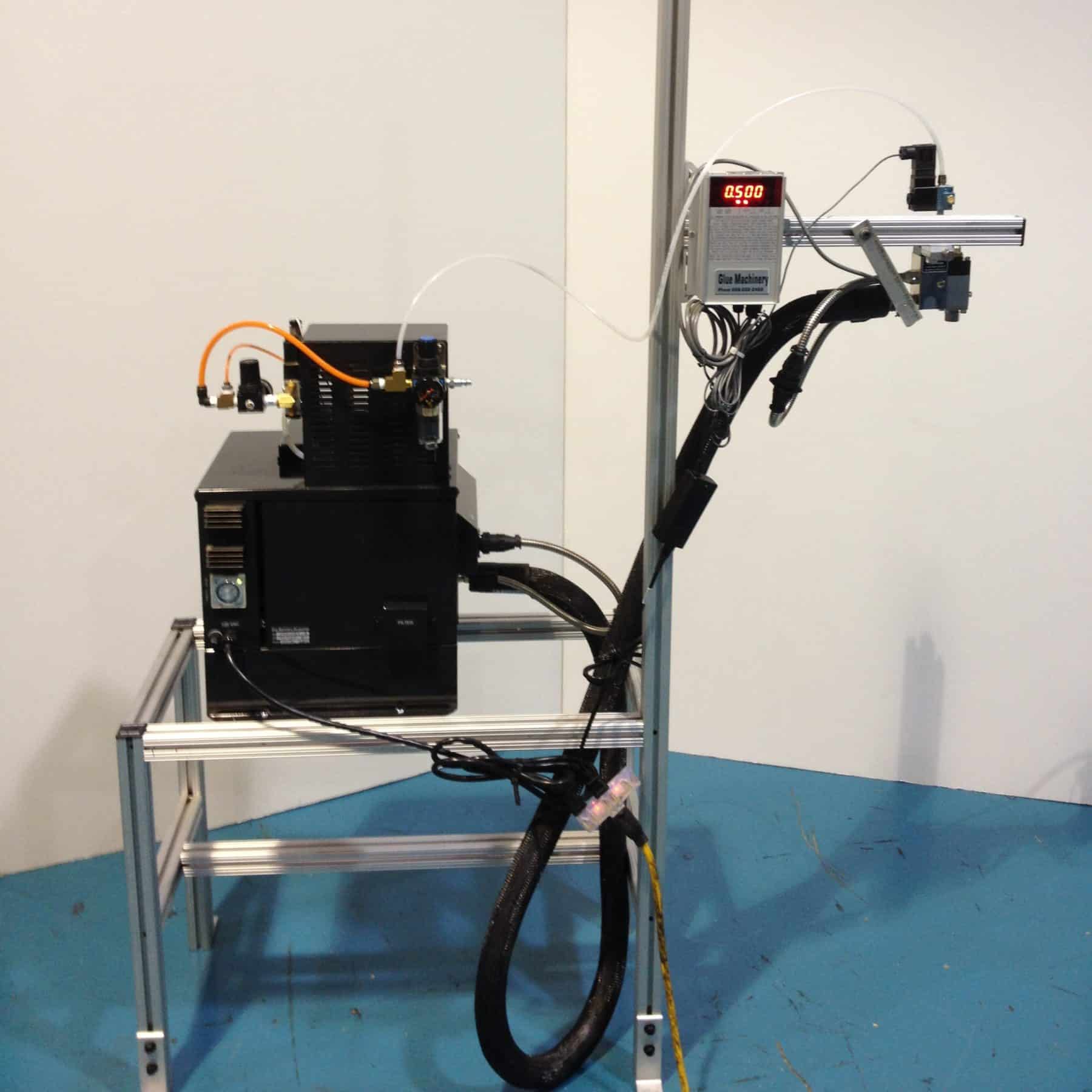 EconoMelt Glue Drop™ Spot Gluing System : Glue Machinery Corp