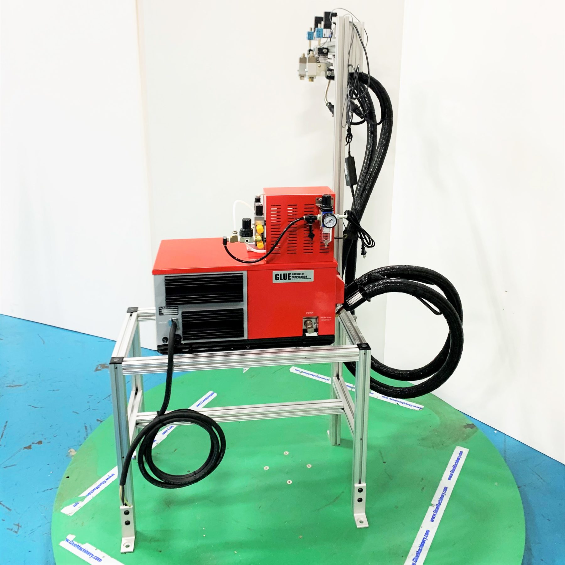 EconoMelt Glue Drop™ TWO Spot Gluing System : Glue Machinery Corp